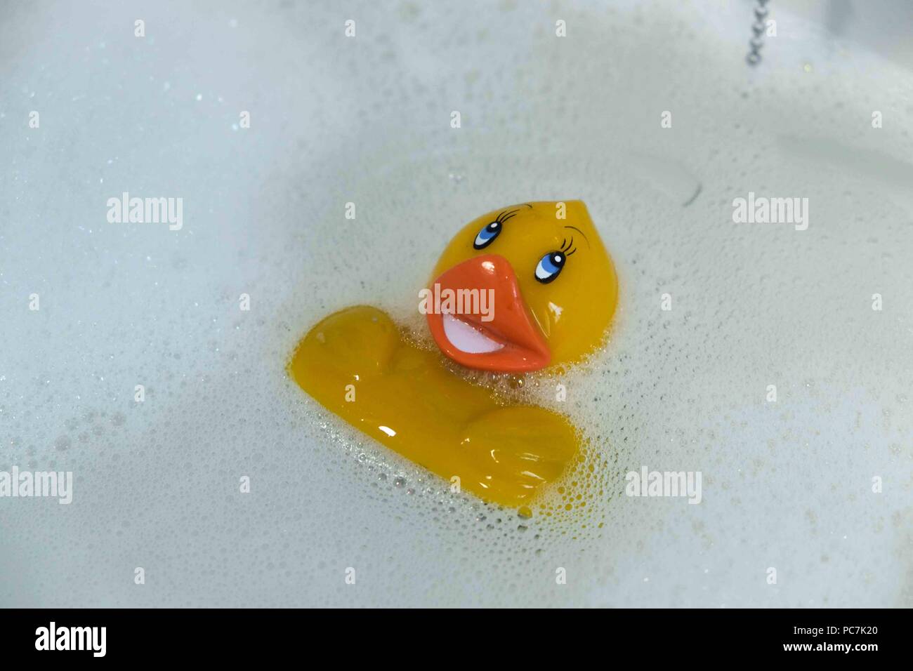 Yellow rubber duck in a sink with water Stock Photo - Alamy