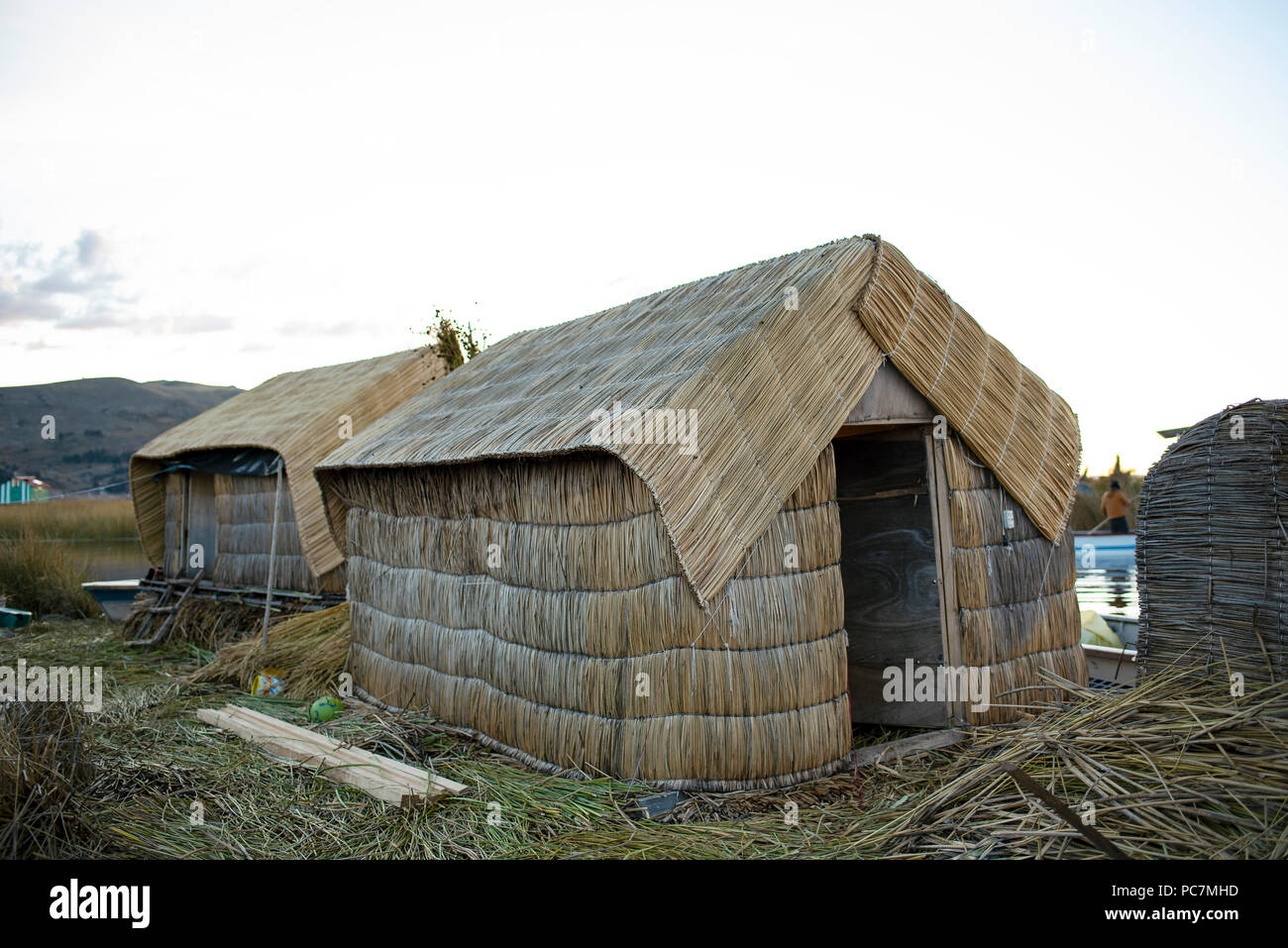 Small huts made of totora reed bundles. Floating islands on Lake ...
