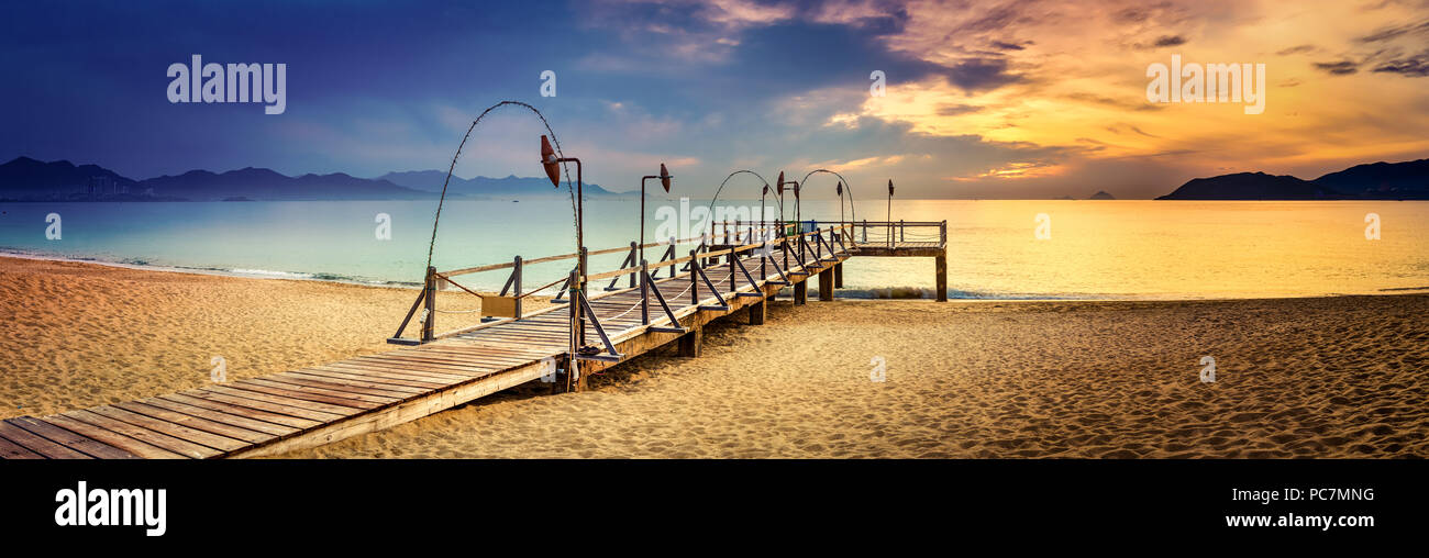 Sunrise over the sea. Pier on the foreground. Amazing landscape ...