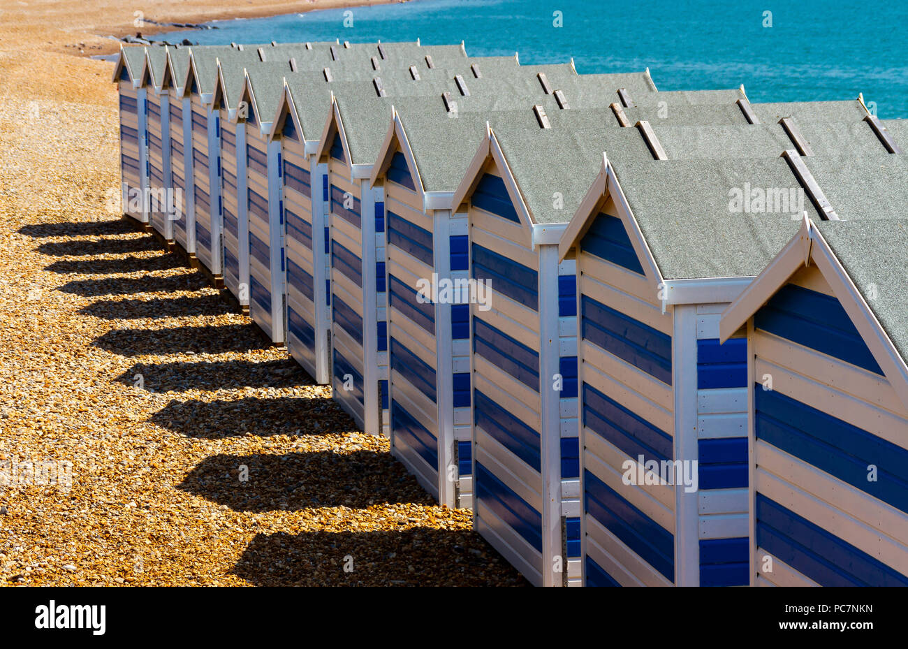 Blue beach huts on Hastings Beach Stock Photo - Alamy