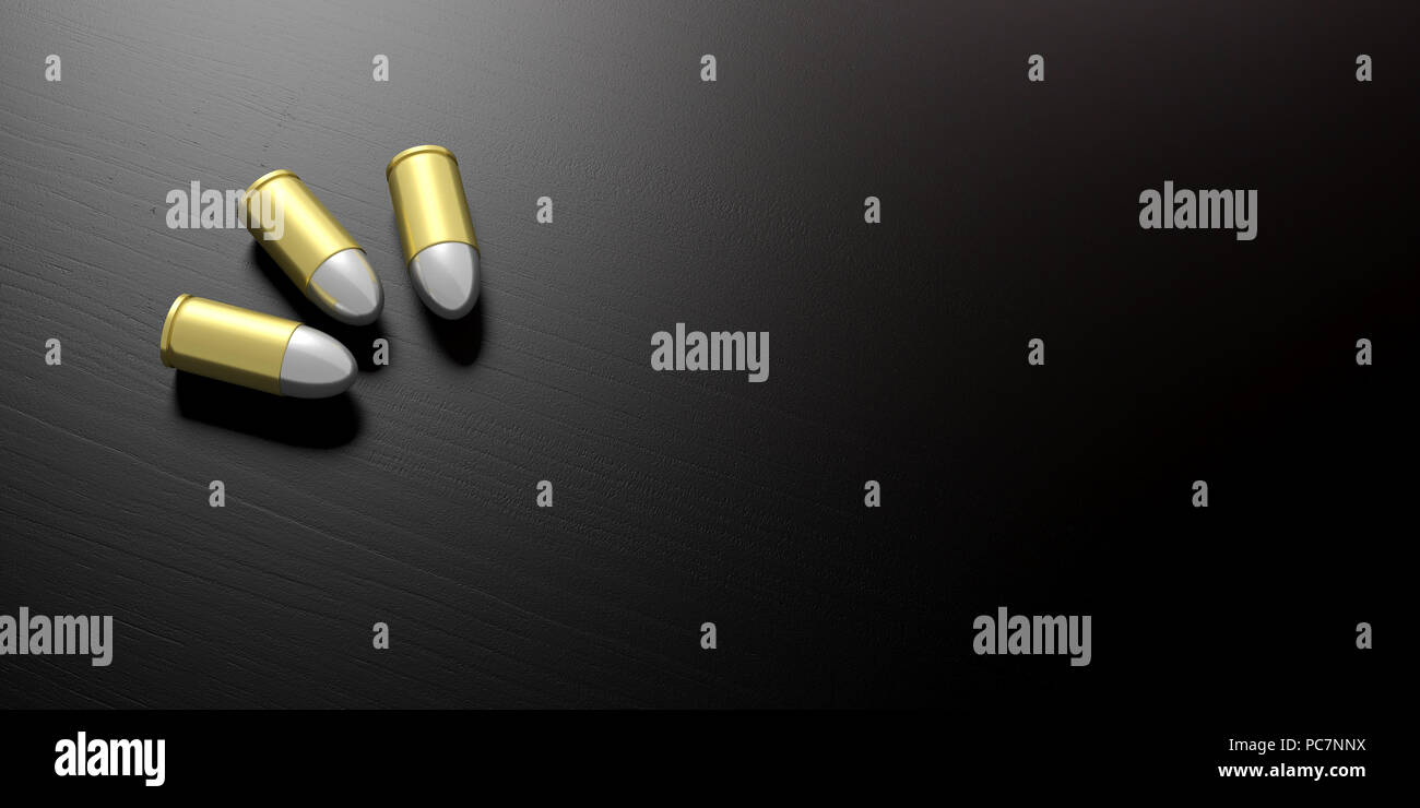 Three gold silver bullets isolated on black wooden background, copy ...