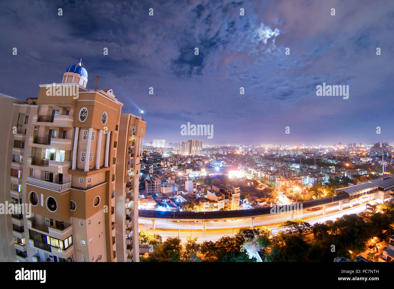 night cityscape of noida with skyscraper, monsoon clouds and moo Stock ...