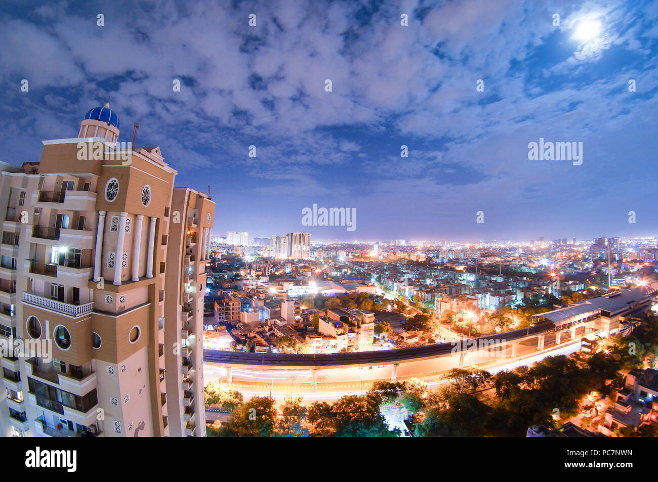 night cityscape of noida with skyscraper, monsoon clouds and moo Stock ...