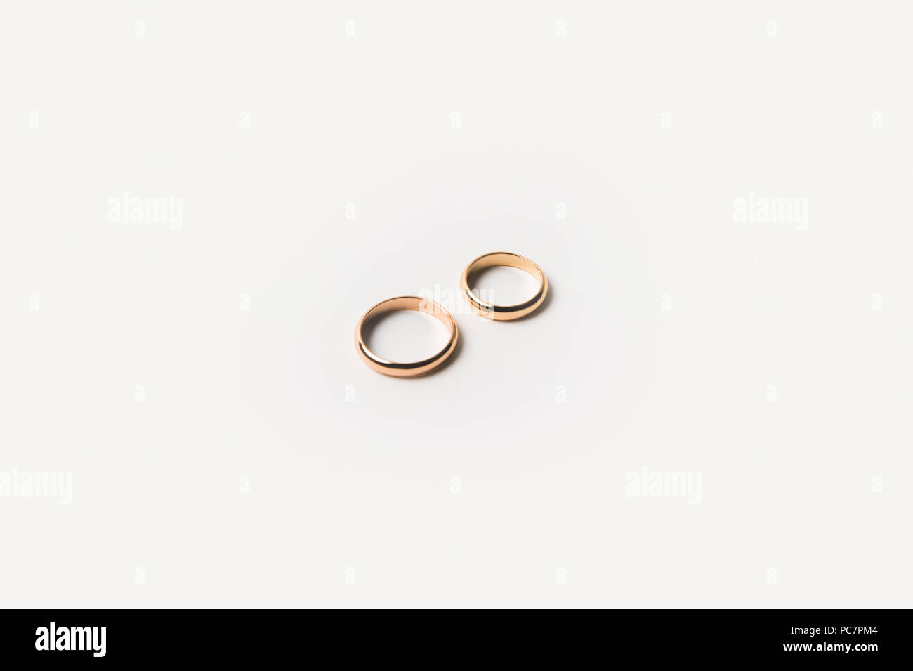 top view of golden wedding rings isolated on white Stock Photo - Alamy