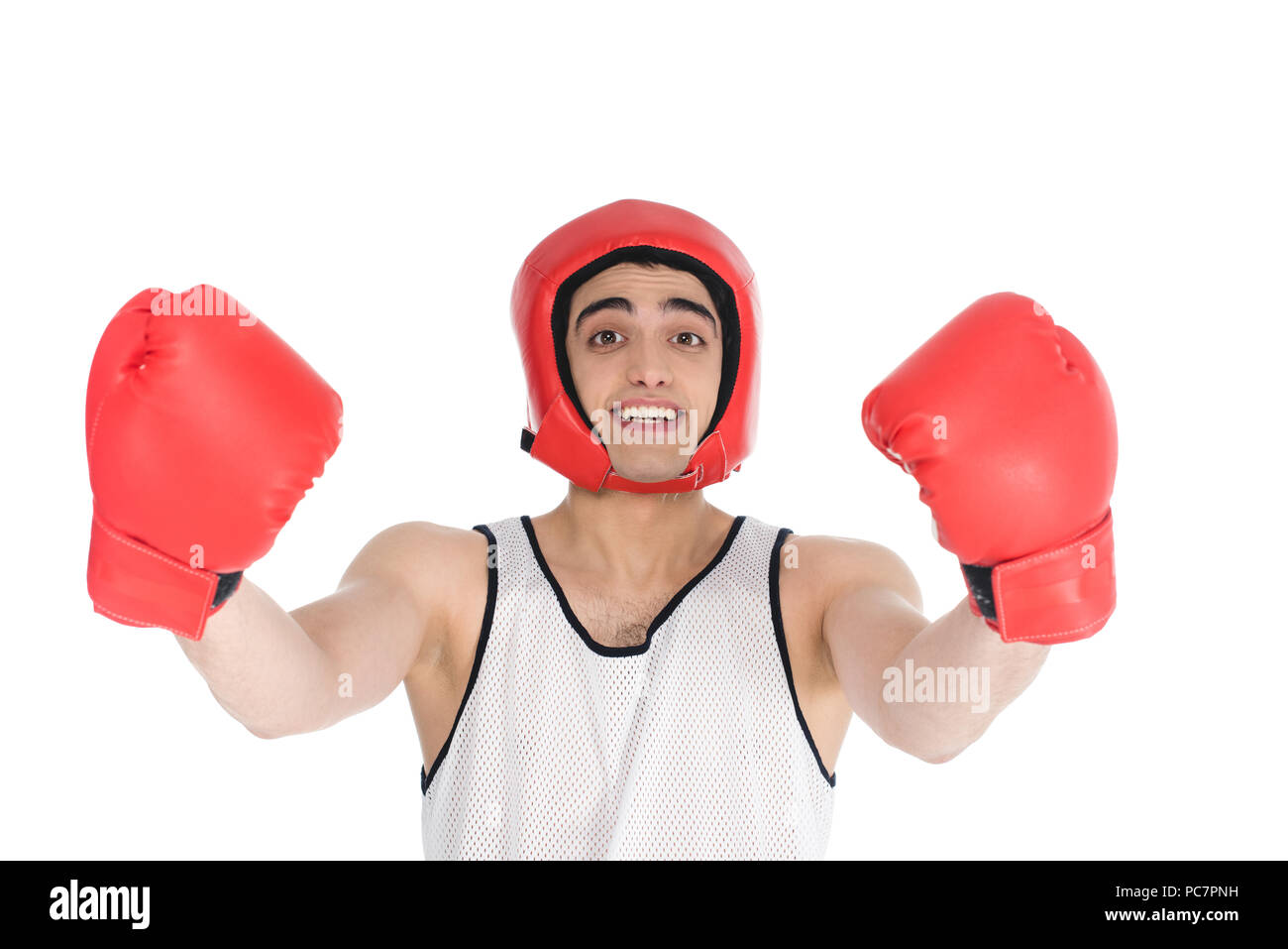 Young skinny sportsman in boxing helmet and gloves isolated on white ...