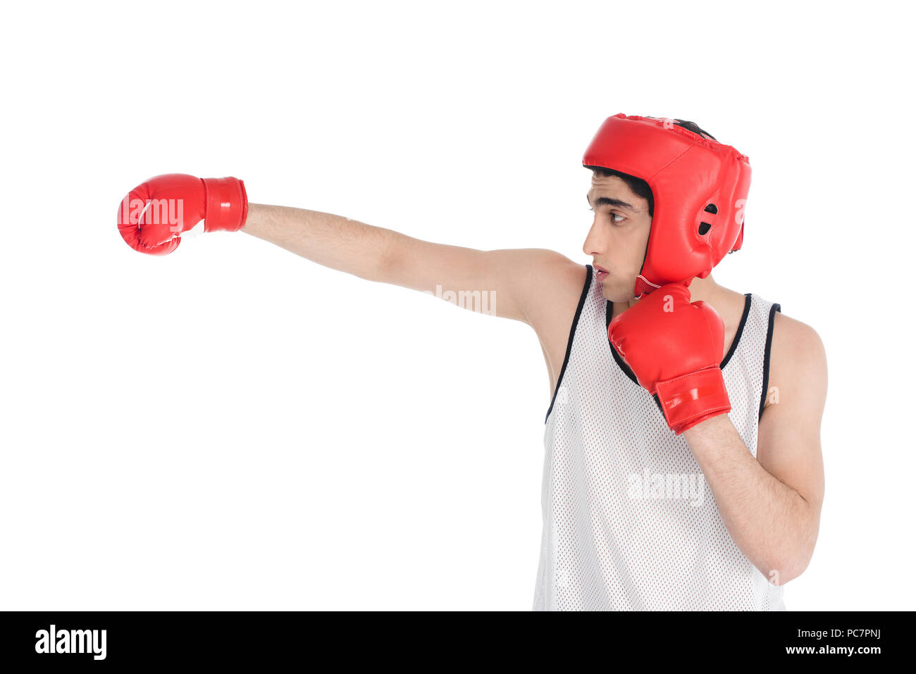 Side view of young boxer beating by hand in glove isolated on white ...