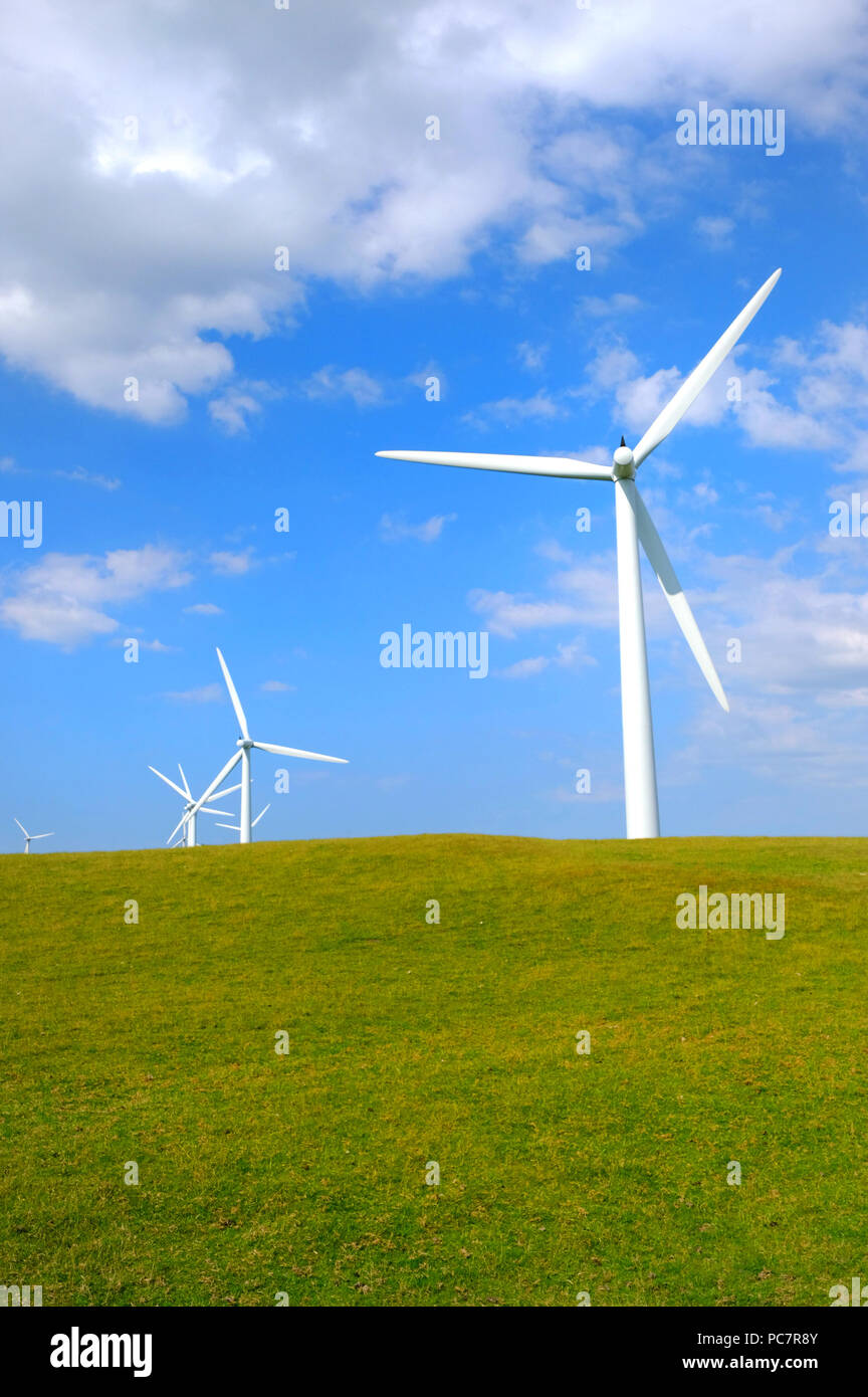 Wind turbines against a blue sky in North Wales Stock Photo - Alamy