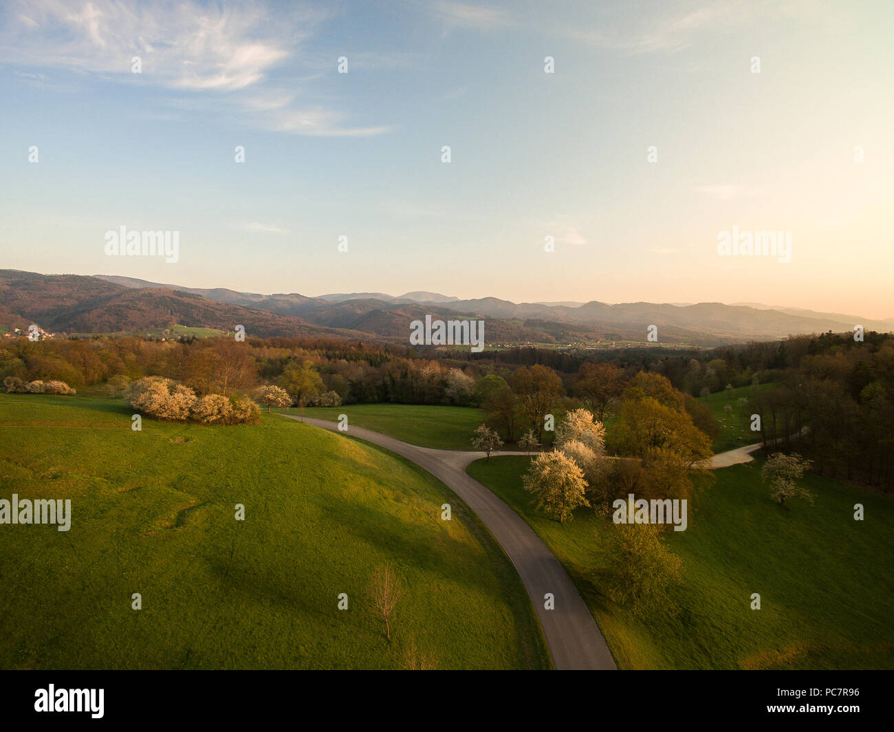 Aerial view of landscape with green hills, road and trees, Germany ...