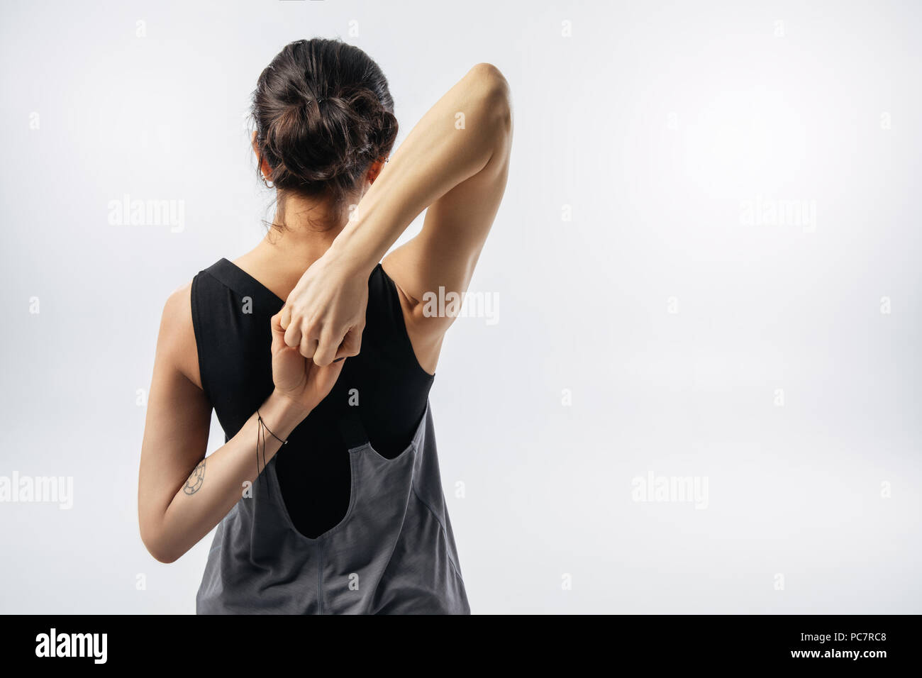 rear view of woman stretching hands isolated on white Stock Photo - Alamy