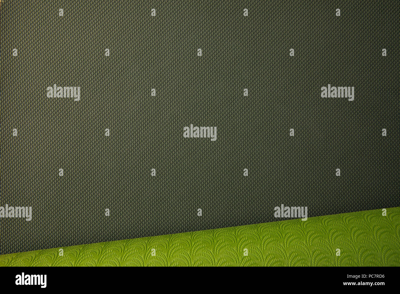 top view of green rolled yoga mat Stock Photo - Alamy