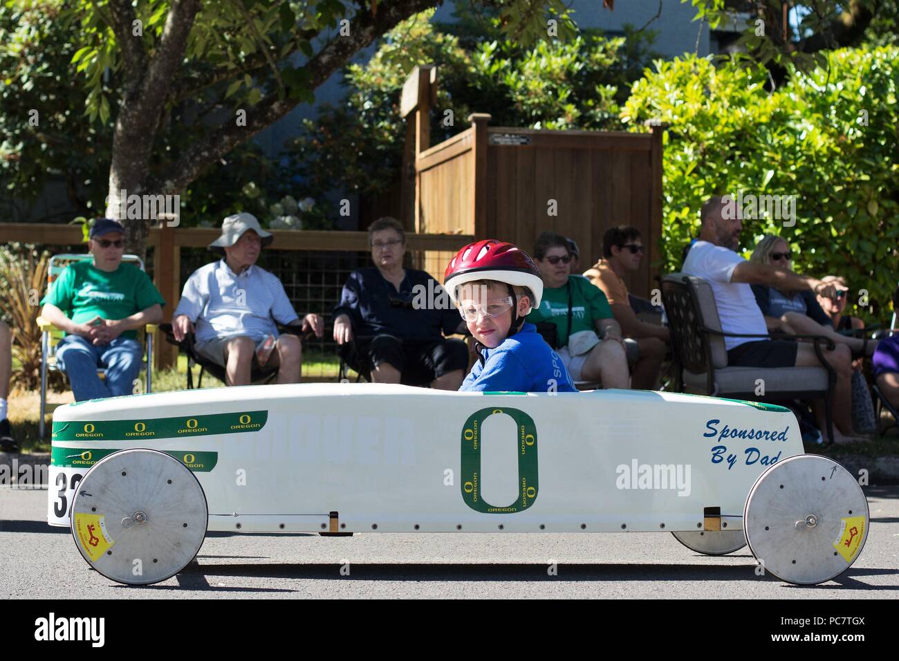 A young boy in a go kart at the Eug Parade in Eugene, Oregon, USA Stock ...