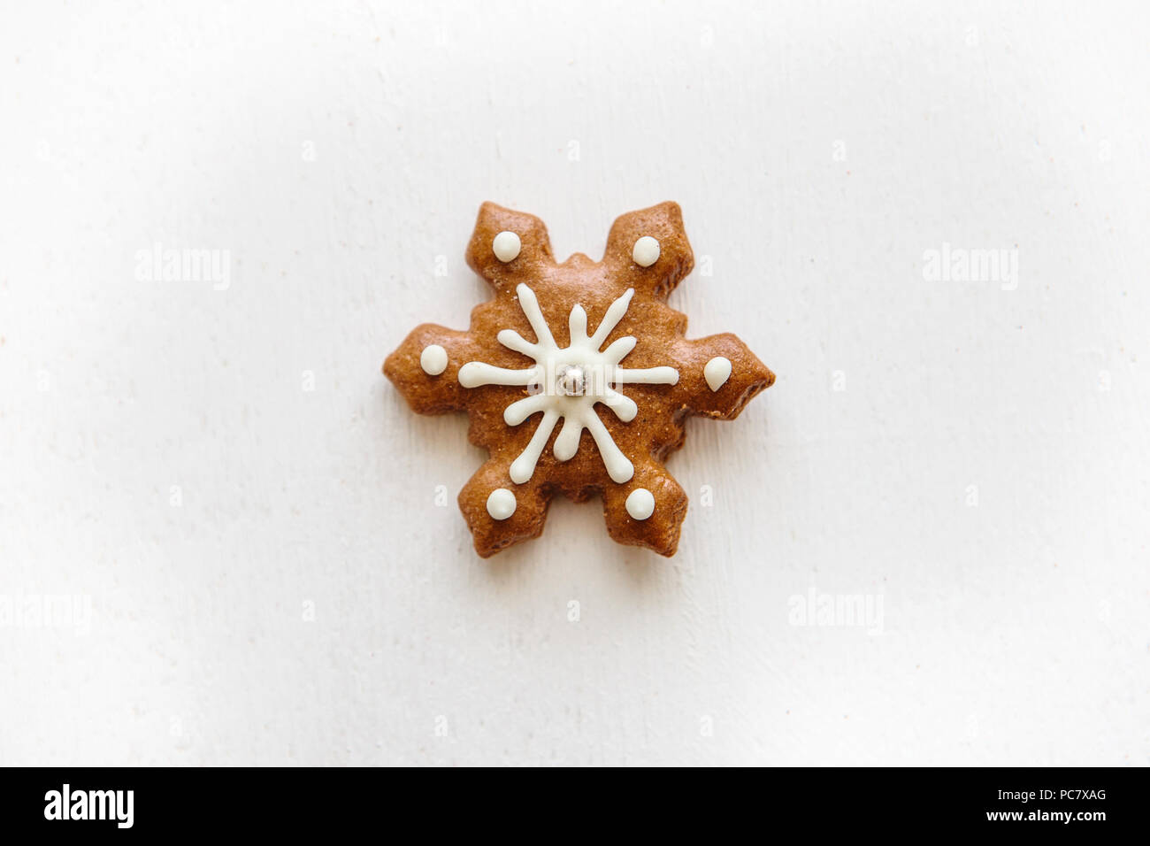 A traditional Christmas gingerbread cookie in the shape of a snowflake ...