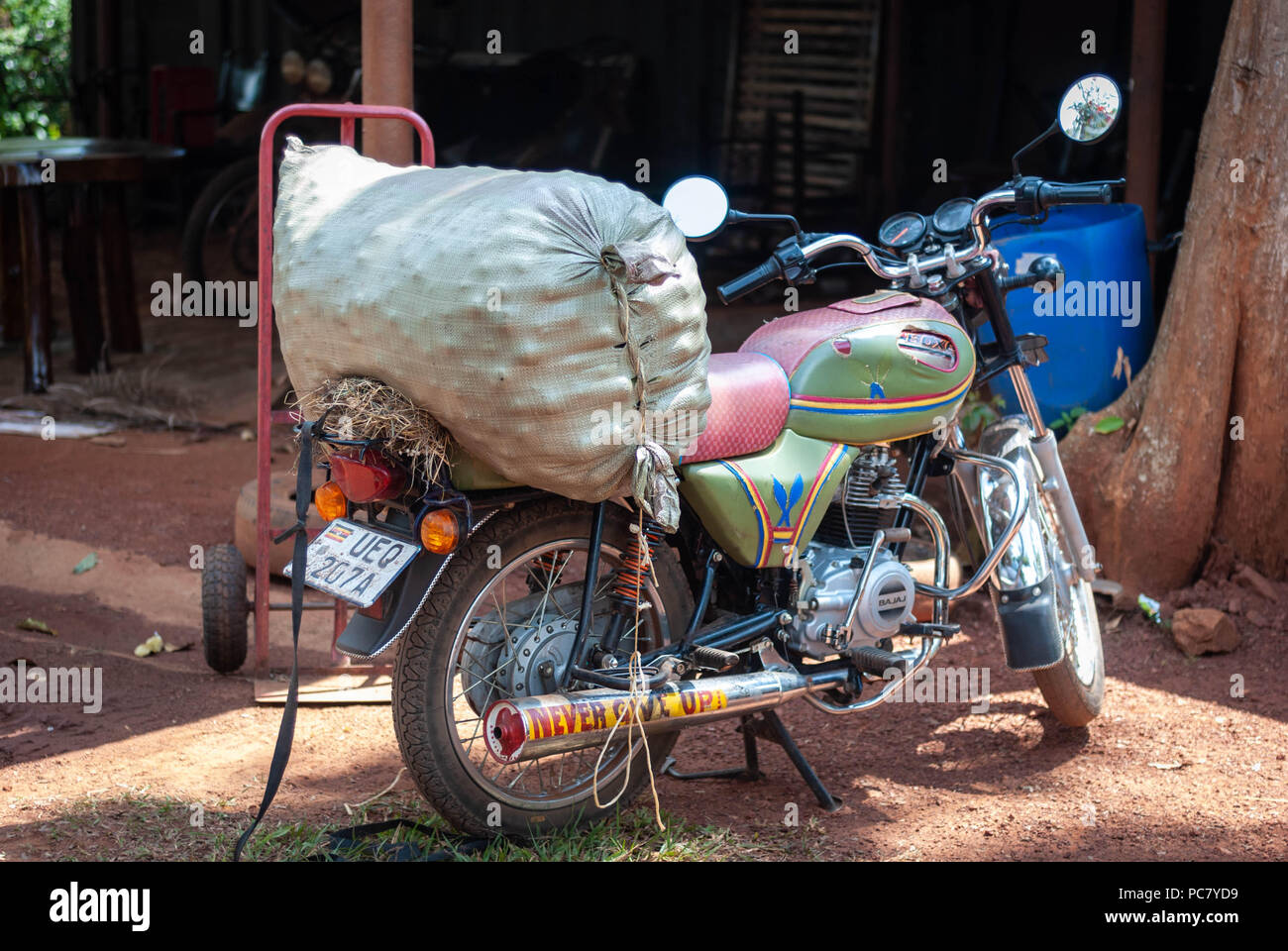 Motorcycle laden with goods, Kampala, Uganda Stock Photo - Alamy