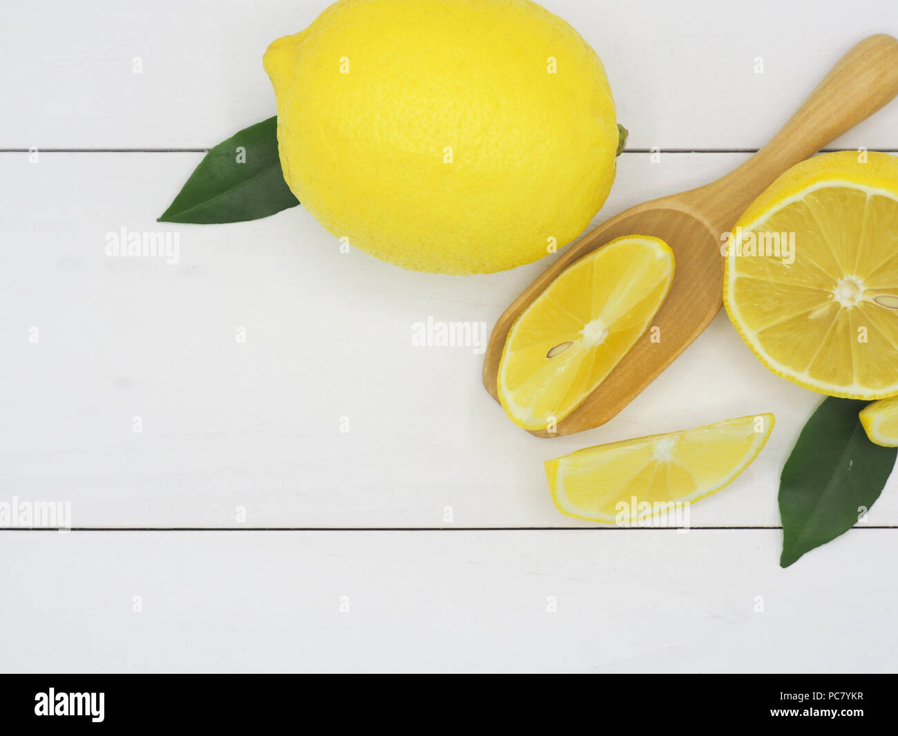 Fresh lemon slice on white wood background Stock Photo - Alamy
