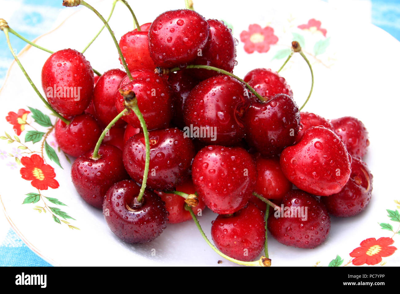 Beautiful plate of cherries Stock Photo - Alamy