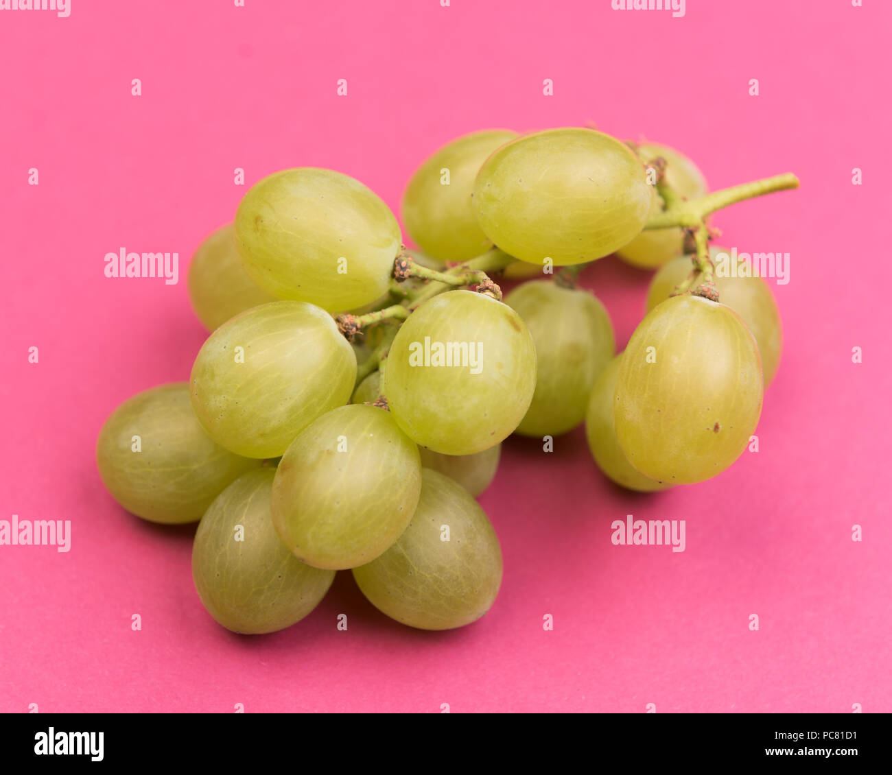 white grapes on a colored background Stock Photo - Alamy