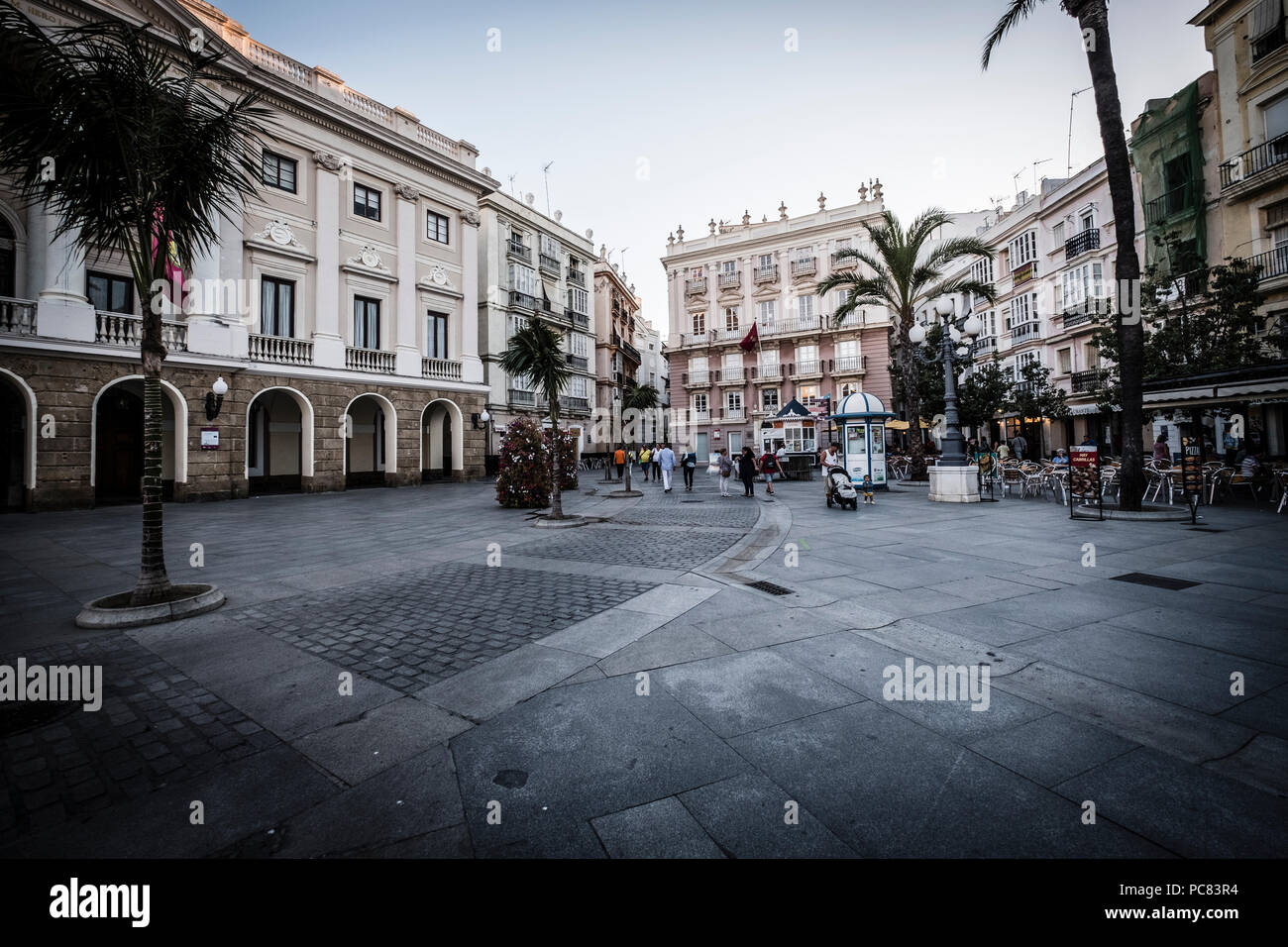 Tourists and locals at the beautiful and historic streets of Cadiz ...