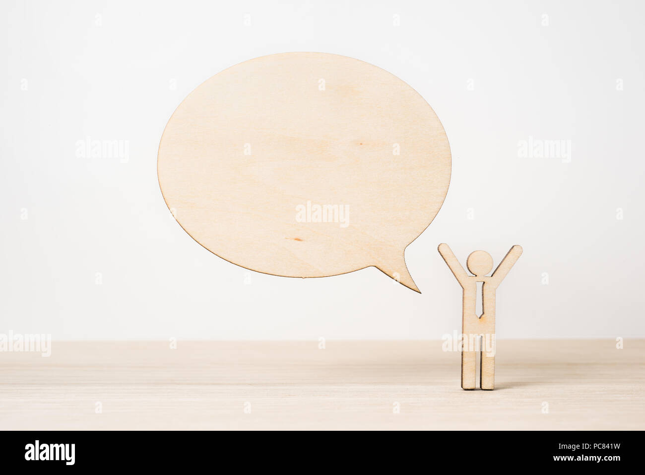 Business and design concept - wooden businessman icon with dialogue ...