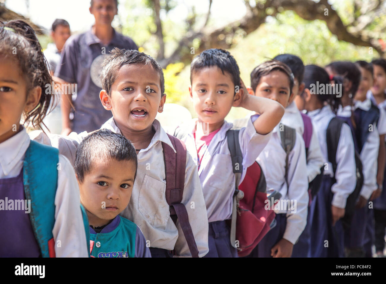 Village elementary school kids forming line for morning prayer ...