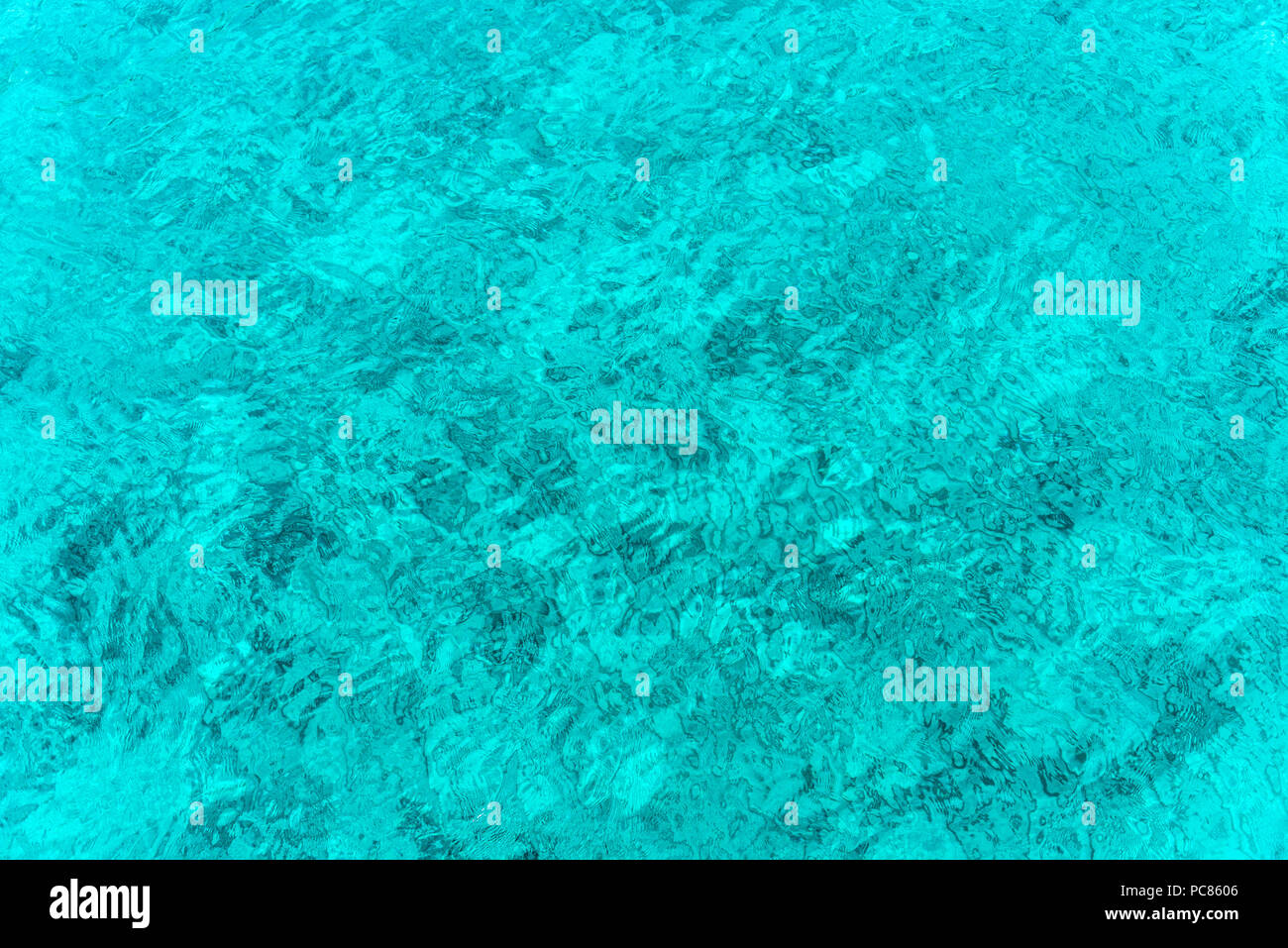 Clean and clear turquoise blue rippled water surface of ocean sea or ...