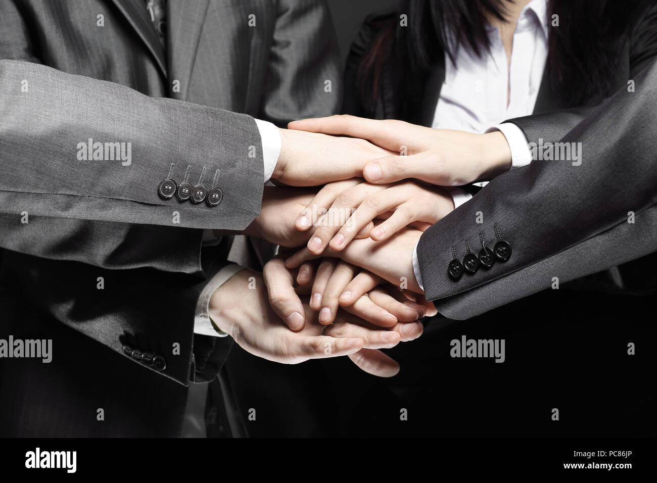 close up.a group of business people folded their hands together Stock ...
