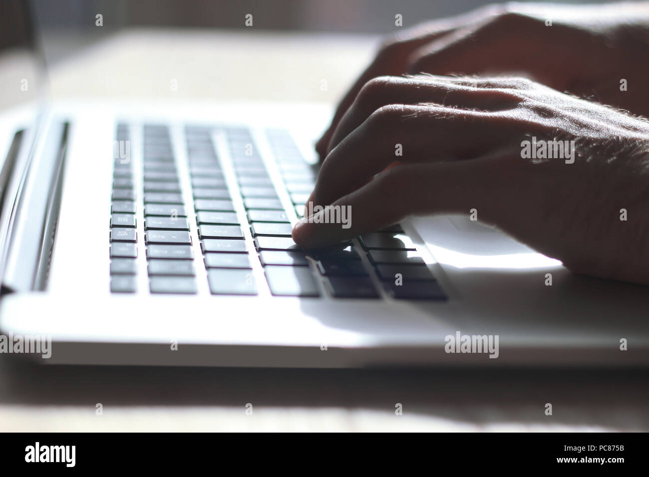 close up. male typing text on laptop keyboard Stock Photo - Alamy
