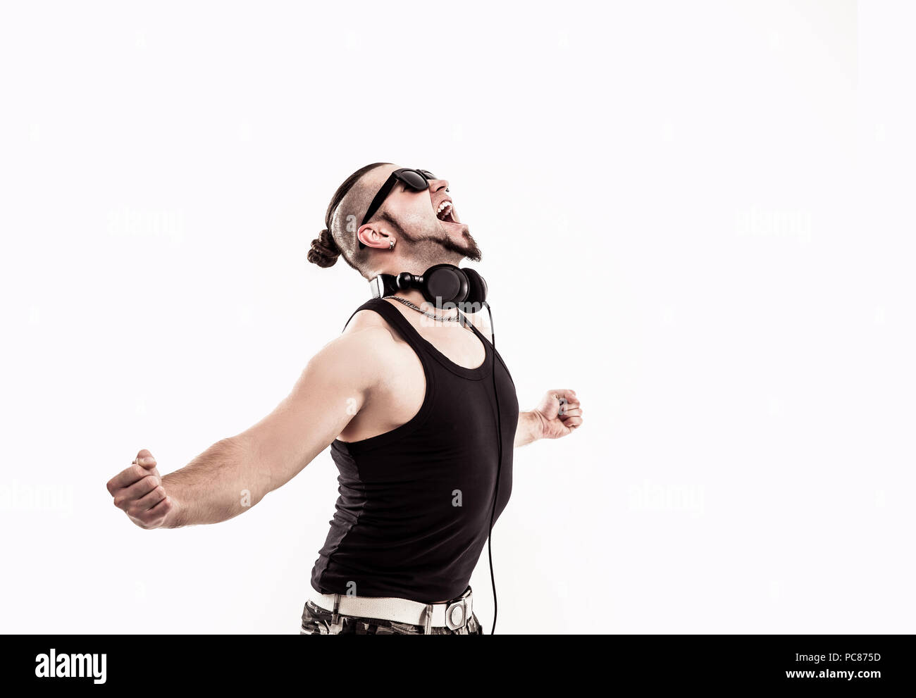 emotional and charismatic DJ - rapper in headphones takes the ra Stock ...