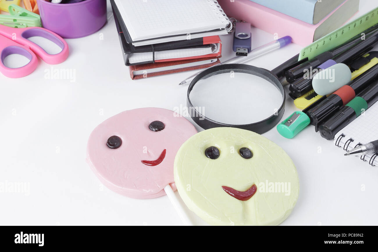 two candy and school supplies on a white background Stock Photo - Alamy