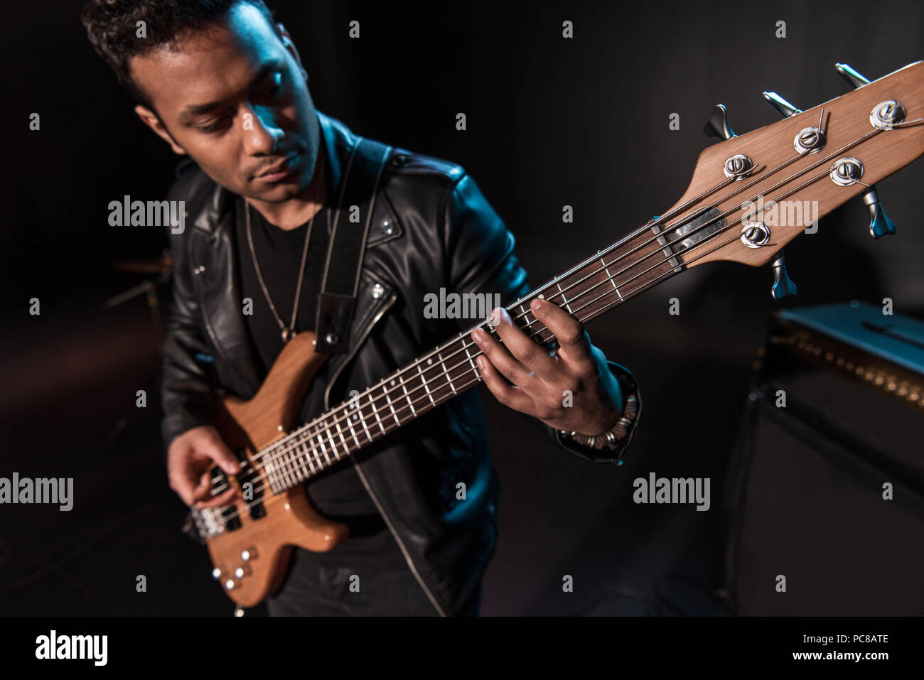 Electric guitar player performing hard rock music with bass guitar on ...