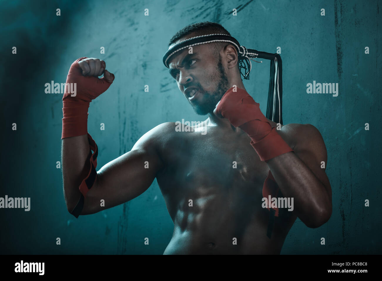 Aggressive young Muay thai boxer training thai boxing, ultimate fight ...