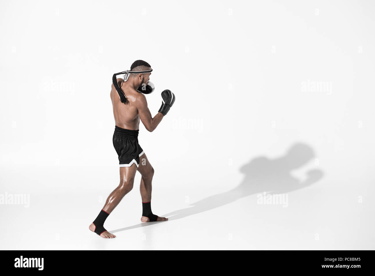 side view of muay thai fighter training isolated on white, fight club ...