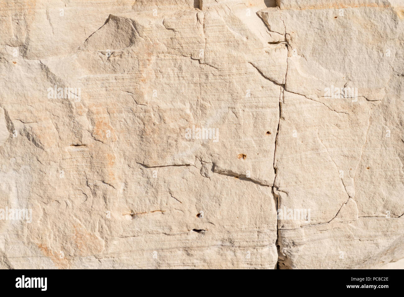 Closeup limestone rock face showing weathered strata for a geological ...