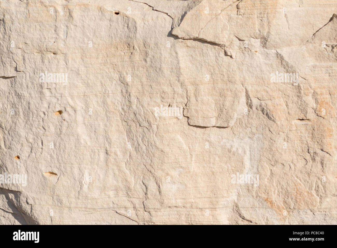 Closeup limestone rock face showing weathered strata for a geological ...
