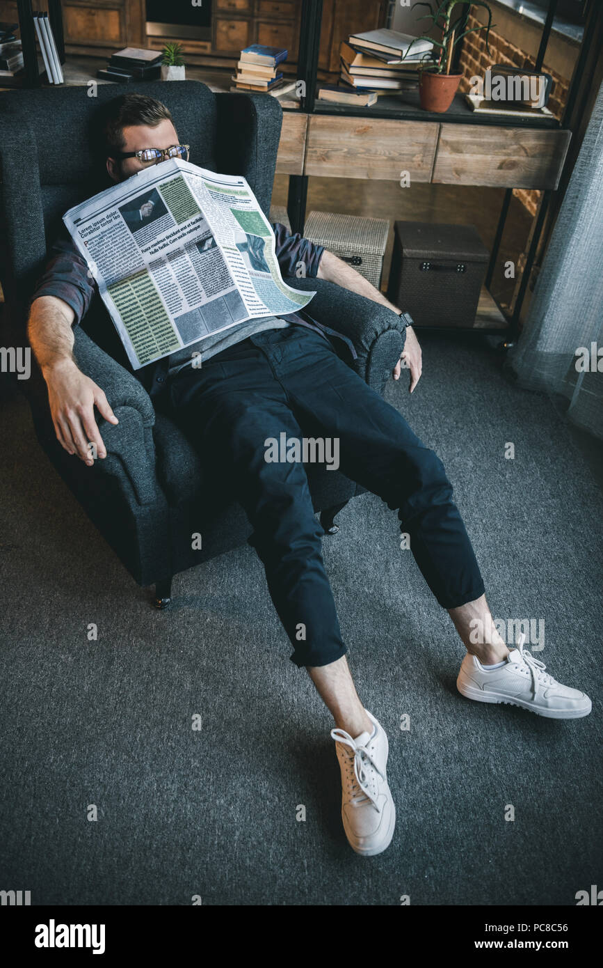Young man sleeping newspaper hi-res stock photography and images - Alamy
