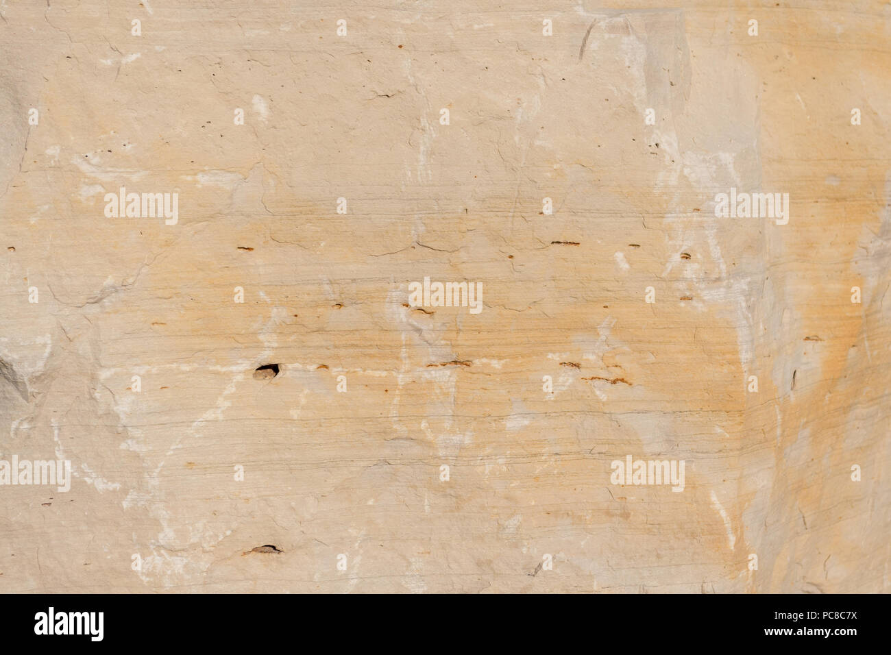 Closeup limestone rock face showing weathered strata for a geological ...