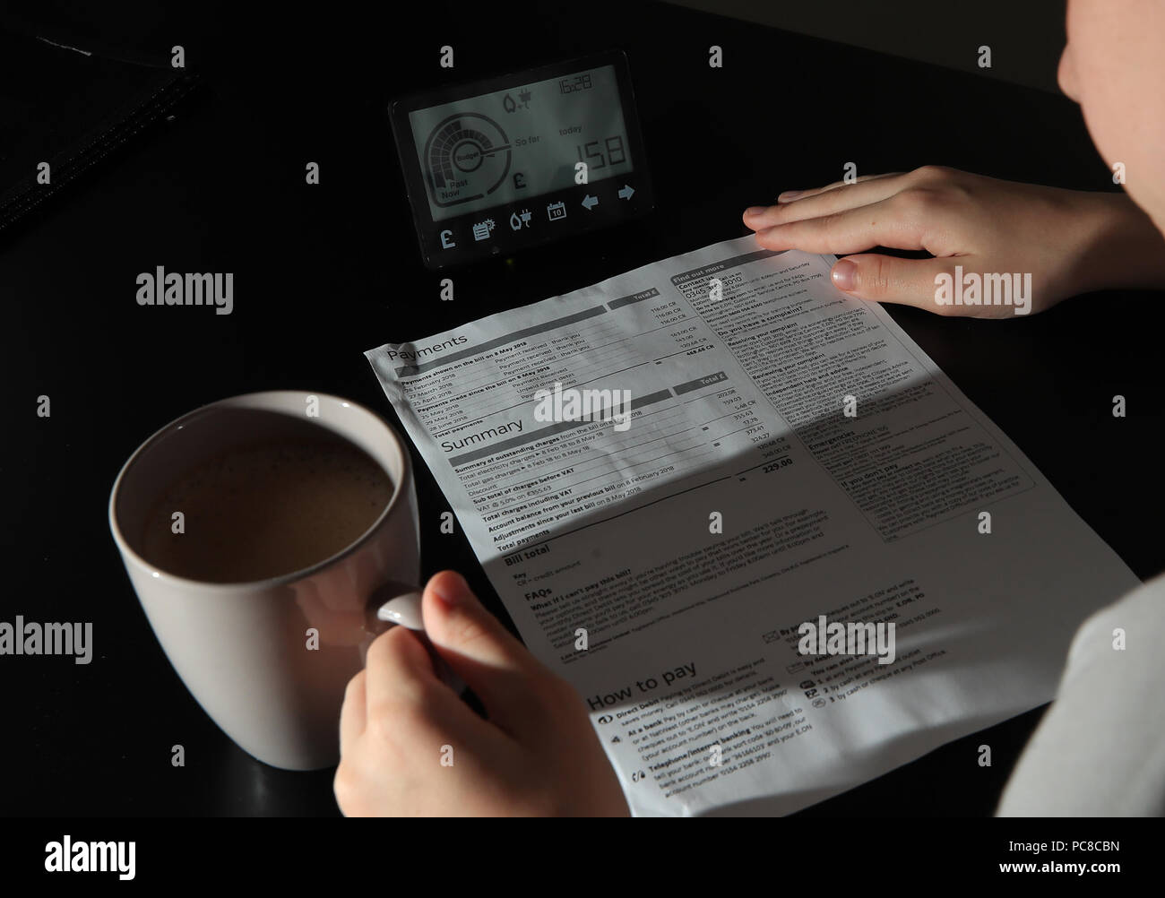 A smart meter next to an energy bill Stock Photo - Alamy