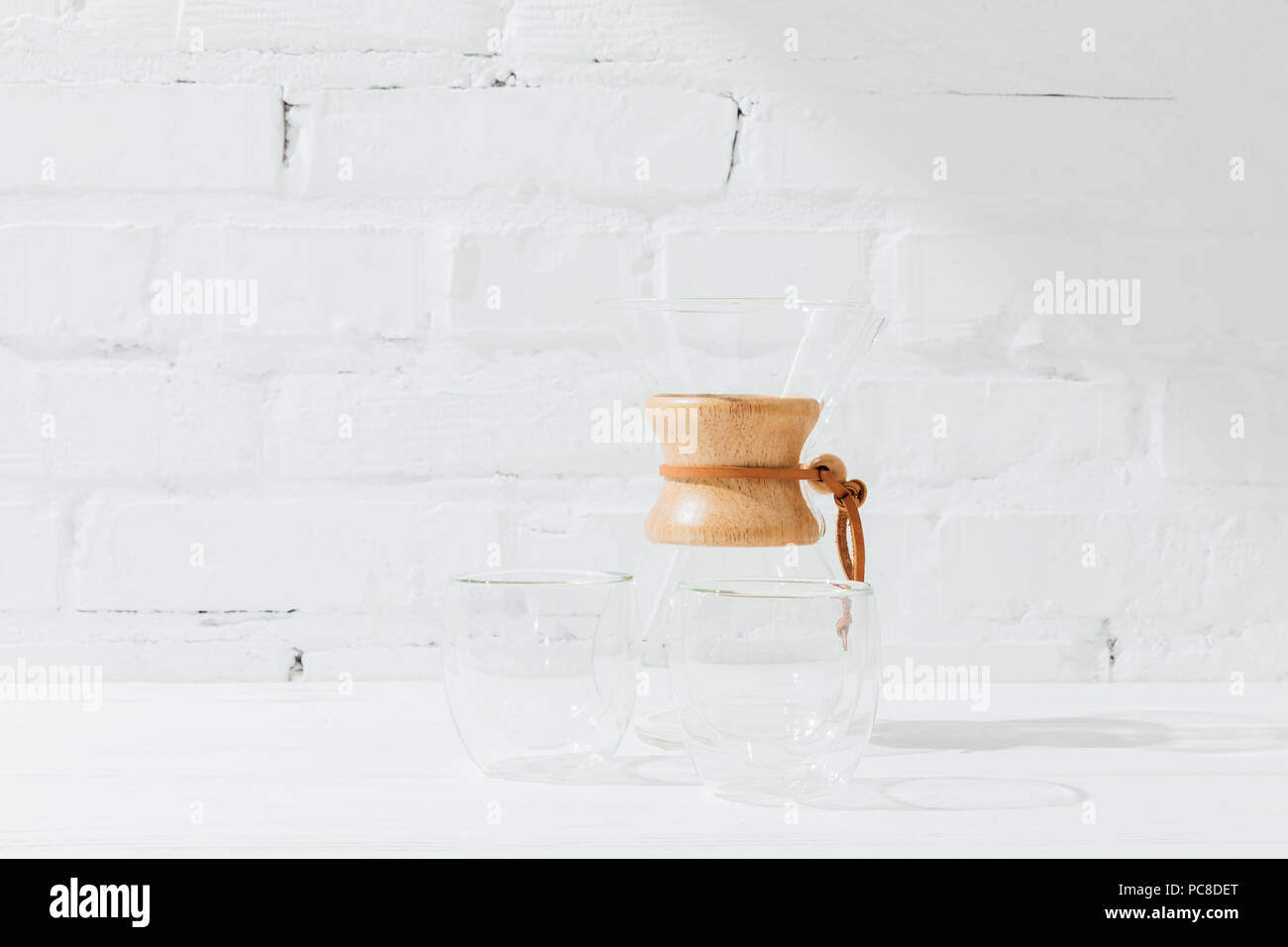 Closeup shot of empty glass mugs and chemex Stock Photo - Alamy