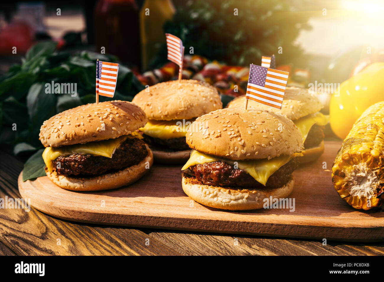Burgers with us flags grilled for outdoors barbecue Stock Photo - Alamy