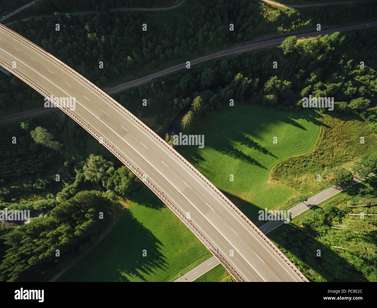 aerial view of empty bridge over beautiful green forest Stock Photo - Alamy