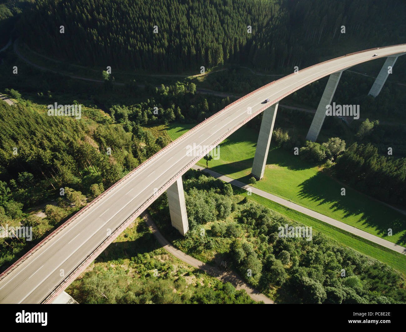 aerial view of bridge over beautiful green forest Stock Photo - Alamy