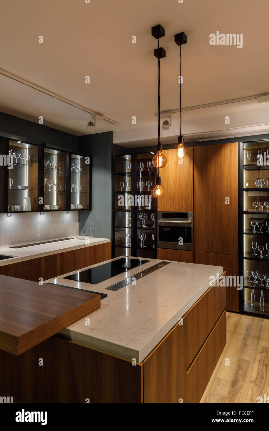 Stylish kitchen with elegant wooden cabinets Stock Photo - Alamy