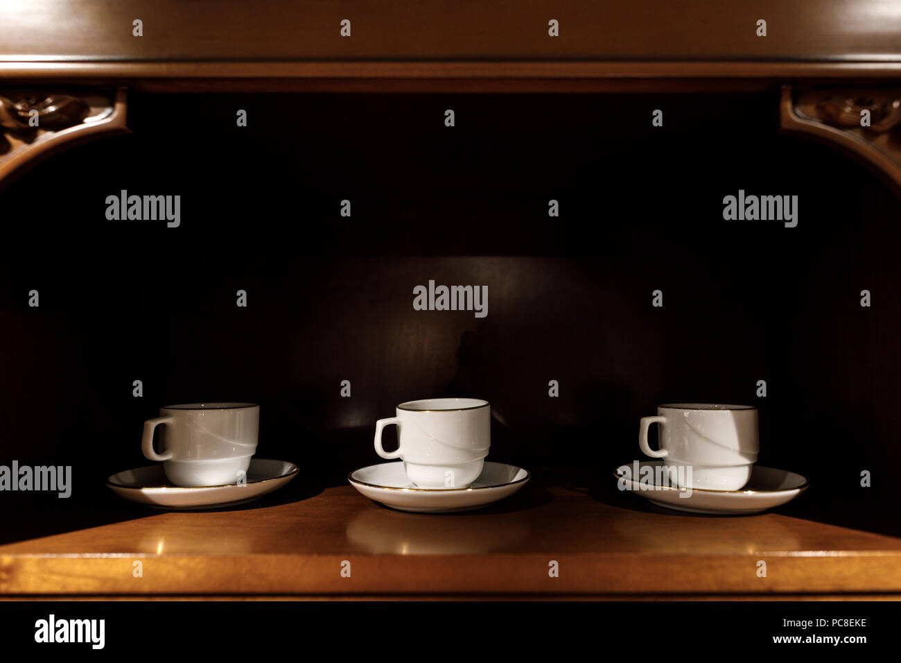 Interior of modern kitchen with white porcelain cups Stock Photo - Alamy