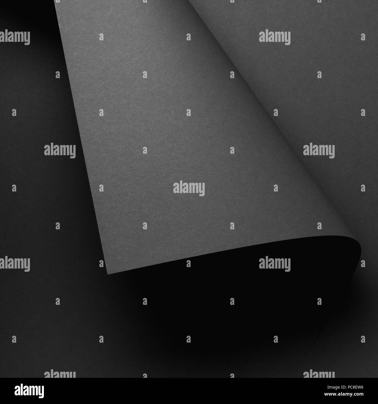 close-up view of grey paper sheet and dark abstract background Stock ...
