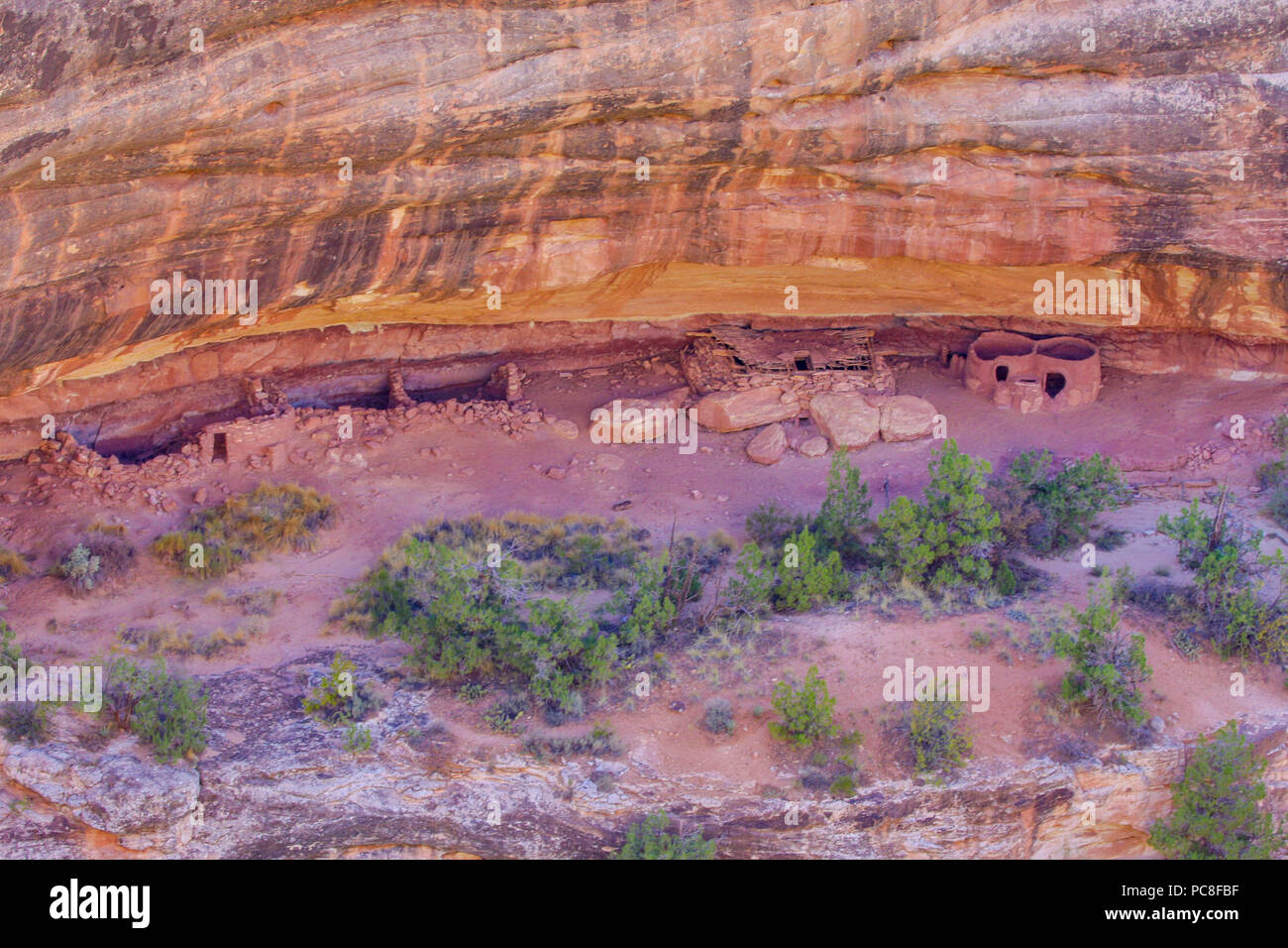 Ancient native american dwellings carved into a rock wall Stock Photo ...