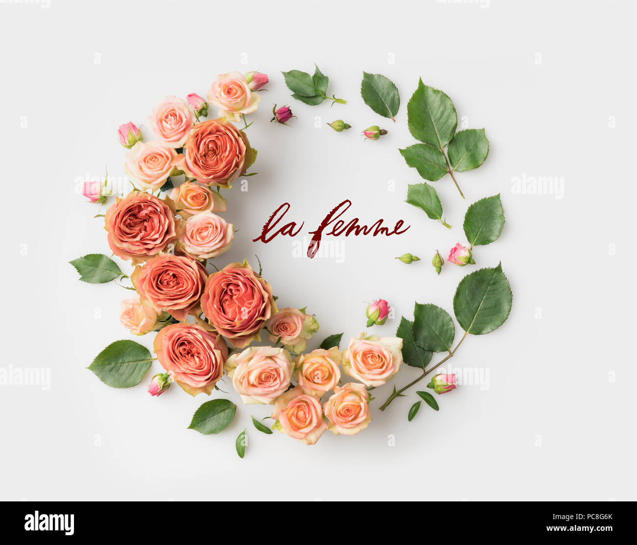 LE FEMME sign surrounded with pink flower wreath with leaves, buds and ...