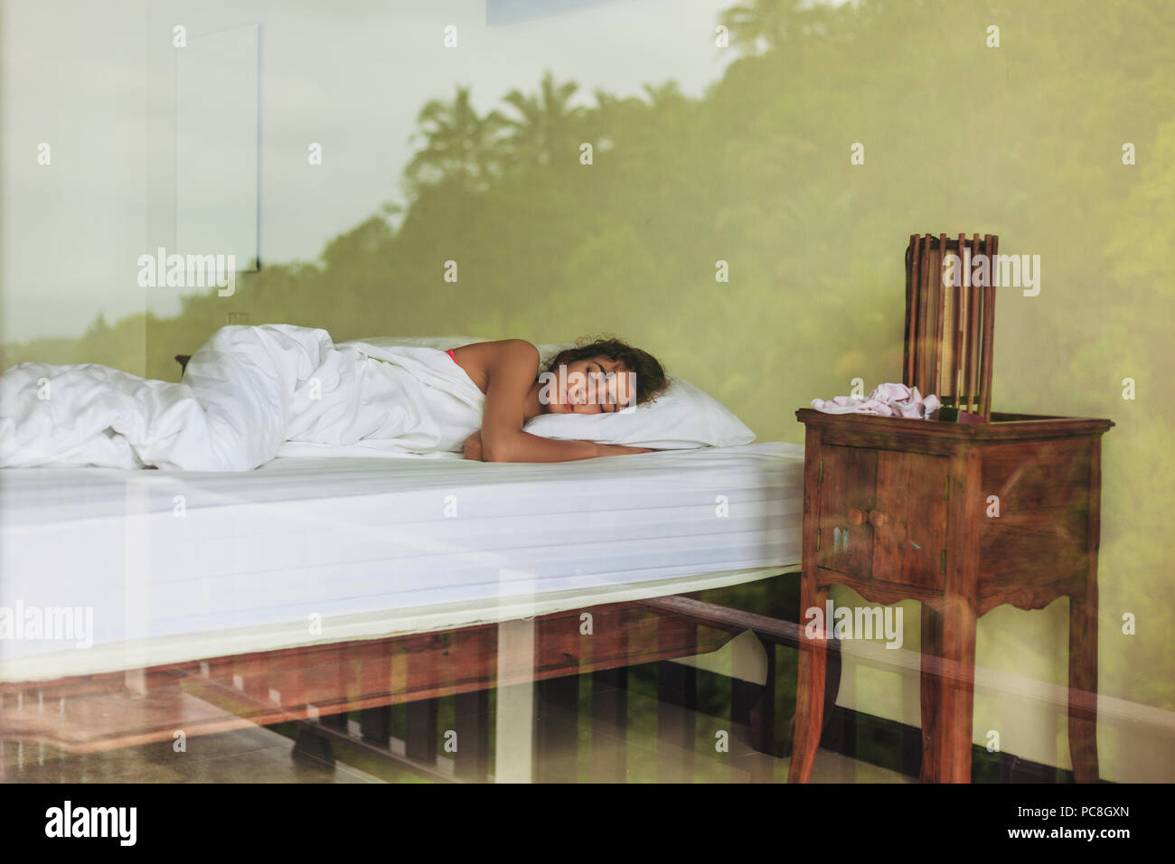 young girl sleeping on bed in hotel Stock Photo - Alamy