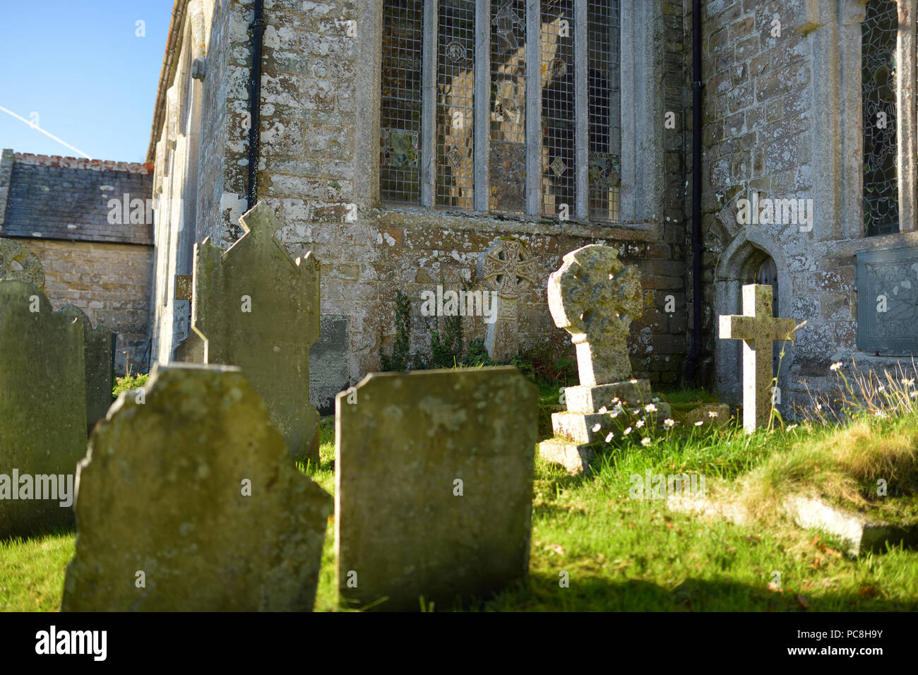 Tombstones in a small old cemetery on the church yard in West Sussex ...