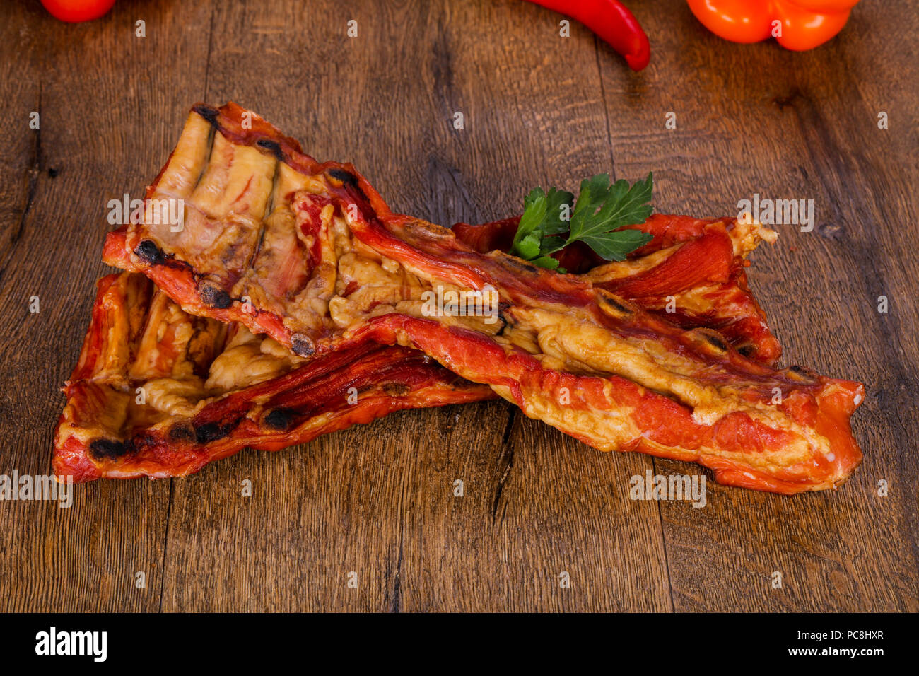 Smoked pork meat over the wooden background Stock Photo - Alamy