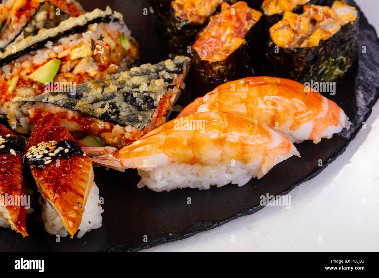 Sushi and rolls mix plate assortment set Stock Photo - Alamy