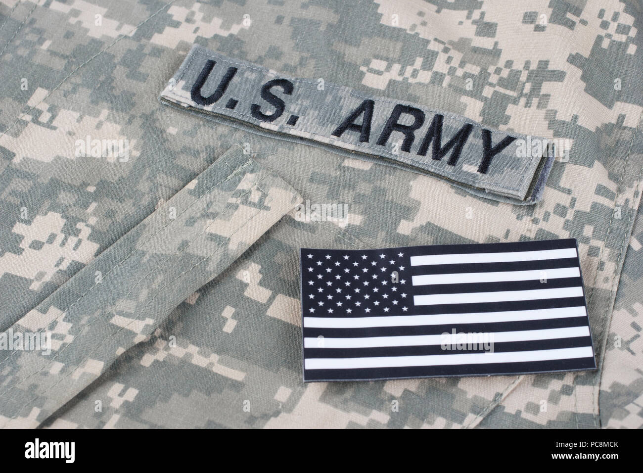 US flag patch with dog tag on Army Combat Uniform background Stock ...